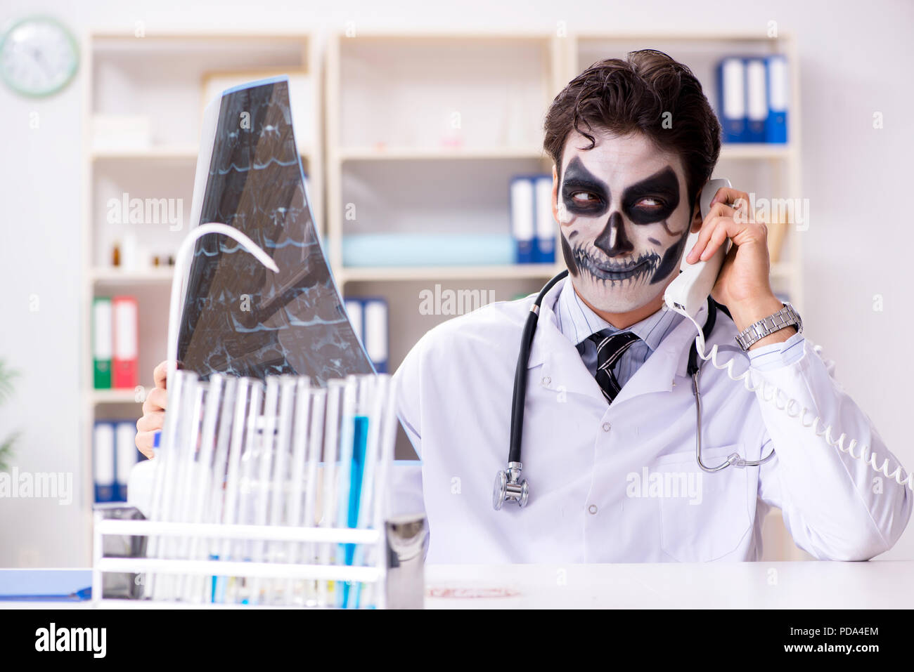 Scary monster doctor working in lab Stock Photo - Alamy