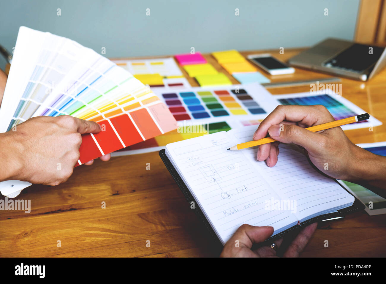 Graphic designers choose colors from the color bands samples for design ...