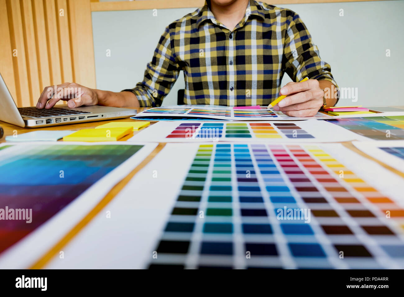 Graphic designers choose colors from the color bands samples for design ...