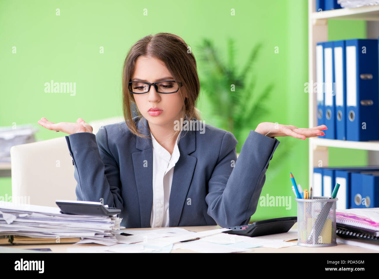 Female financial manager working in the office Stock Photo - Alamy