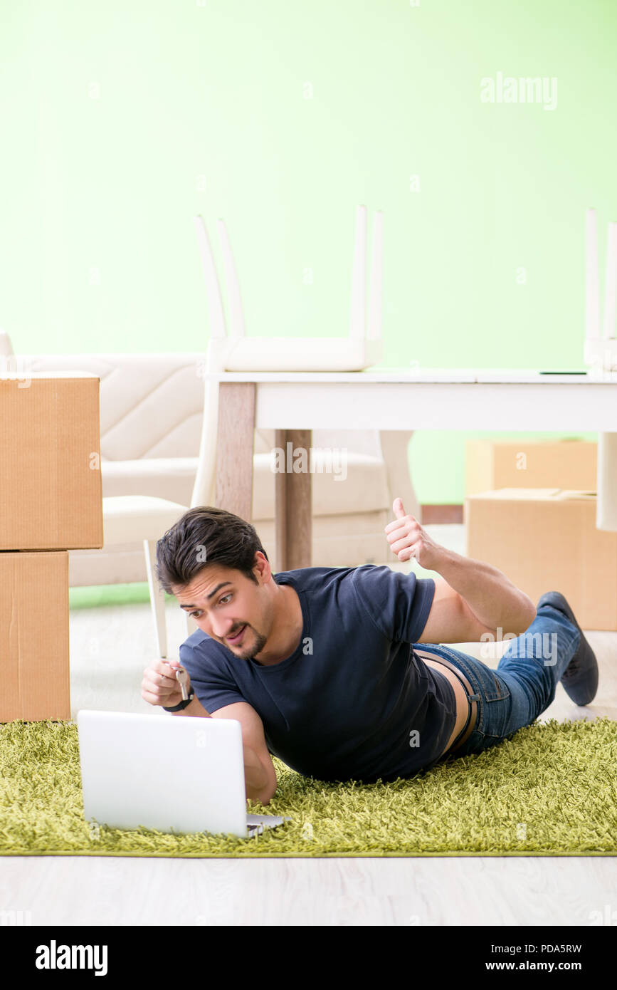 Man moving house with boxes Stock Photo - Alamy
