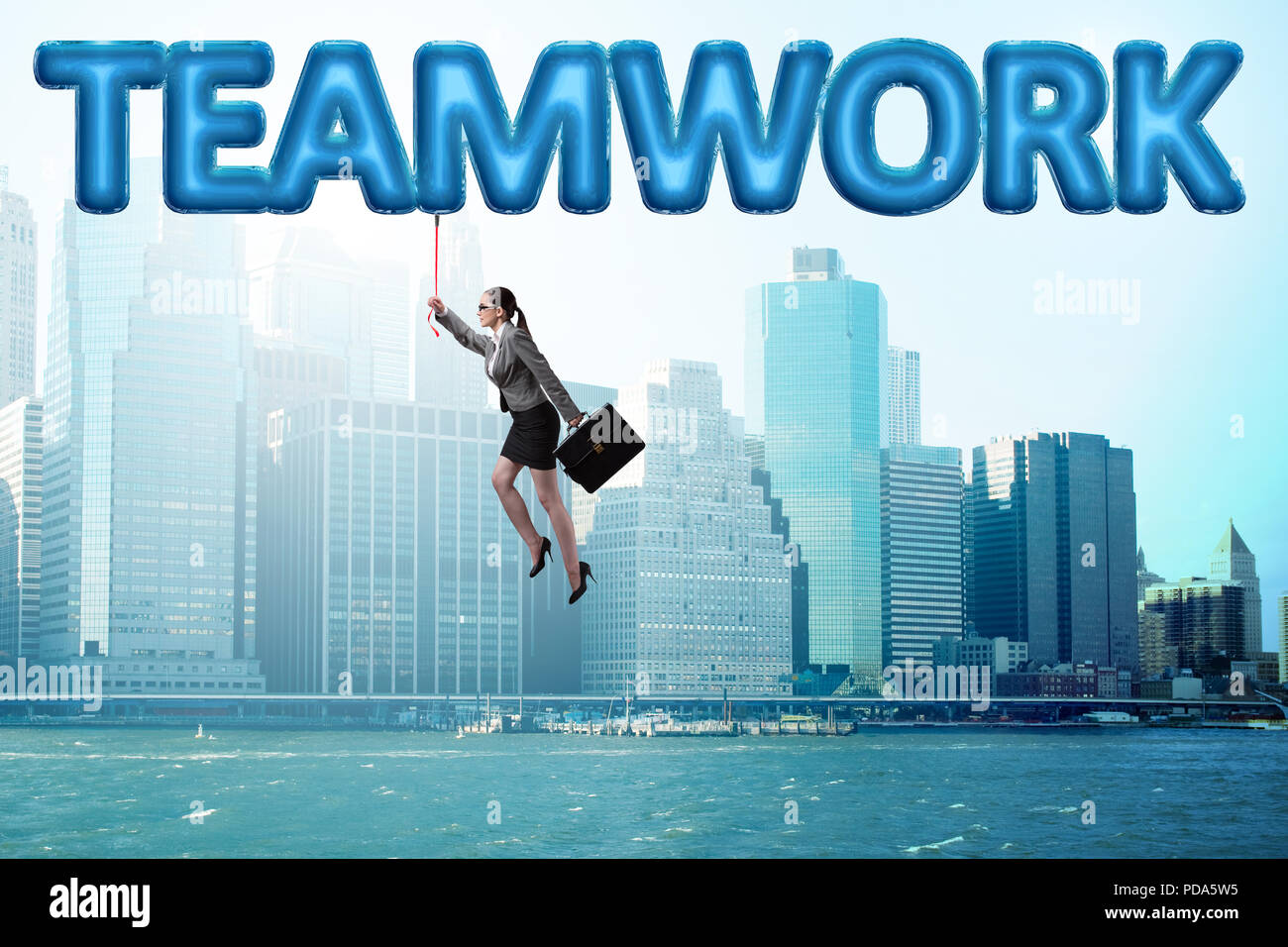 Businesswoman flying in teamwork concept Stock Photo - Alamy