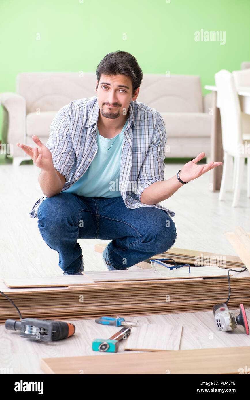 Man showing installation hardwood flooring hi-res stock photography and ...