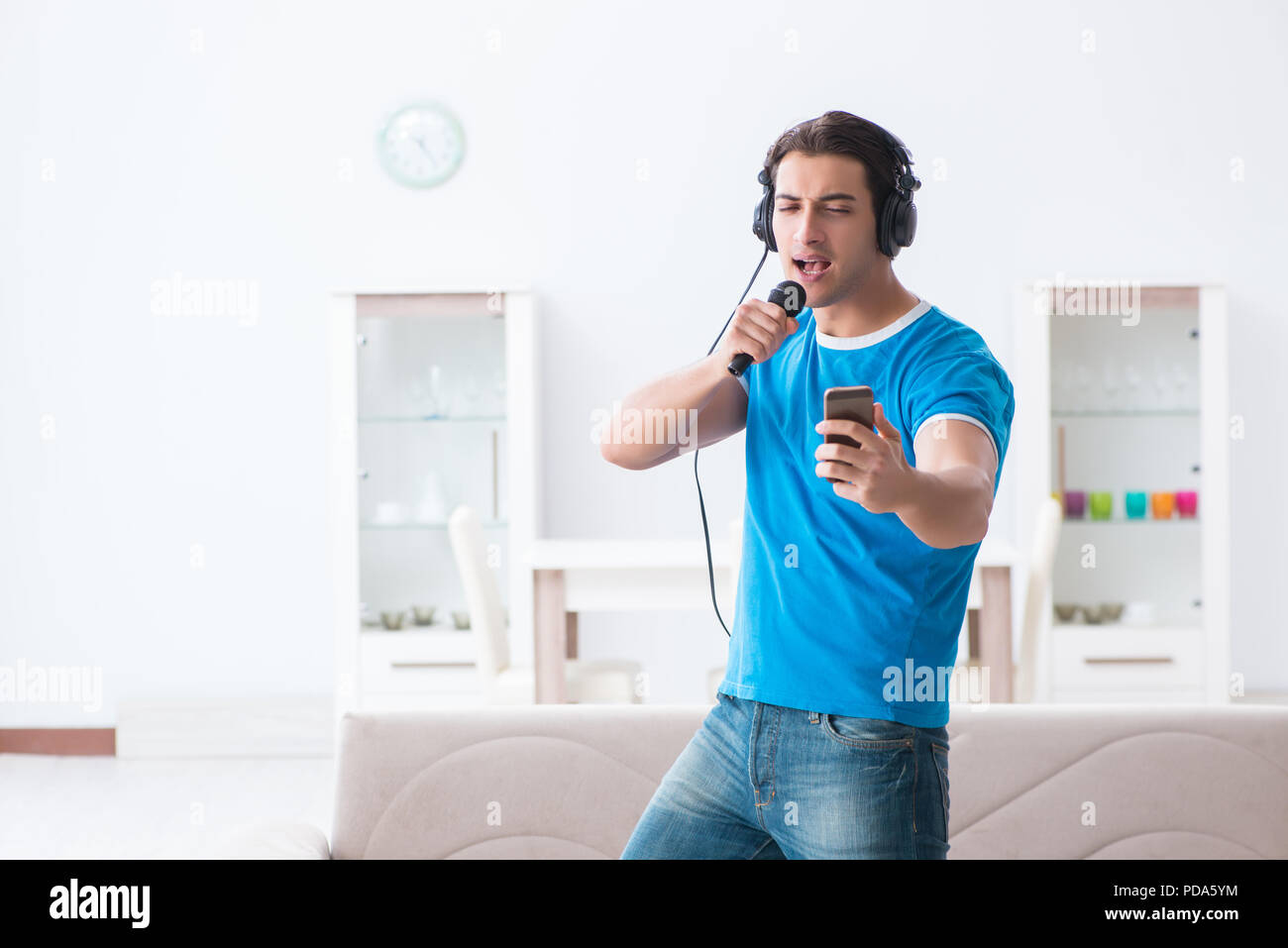 Teen home singing karaoke hi-res stock photography and images - Alamy
