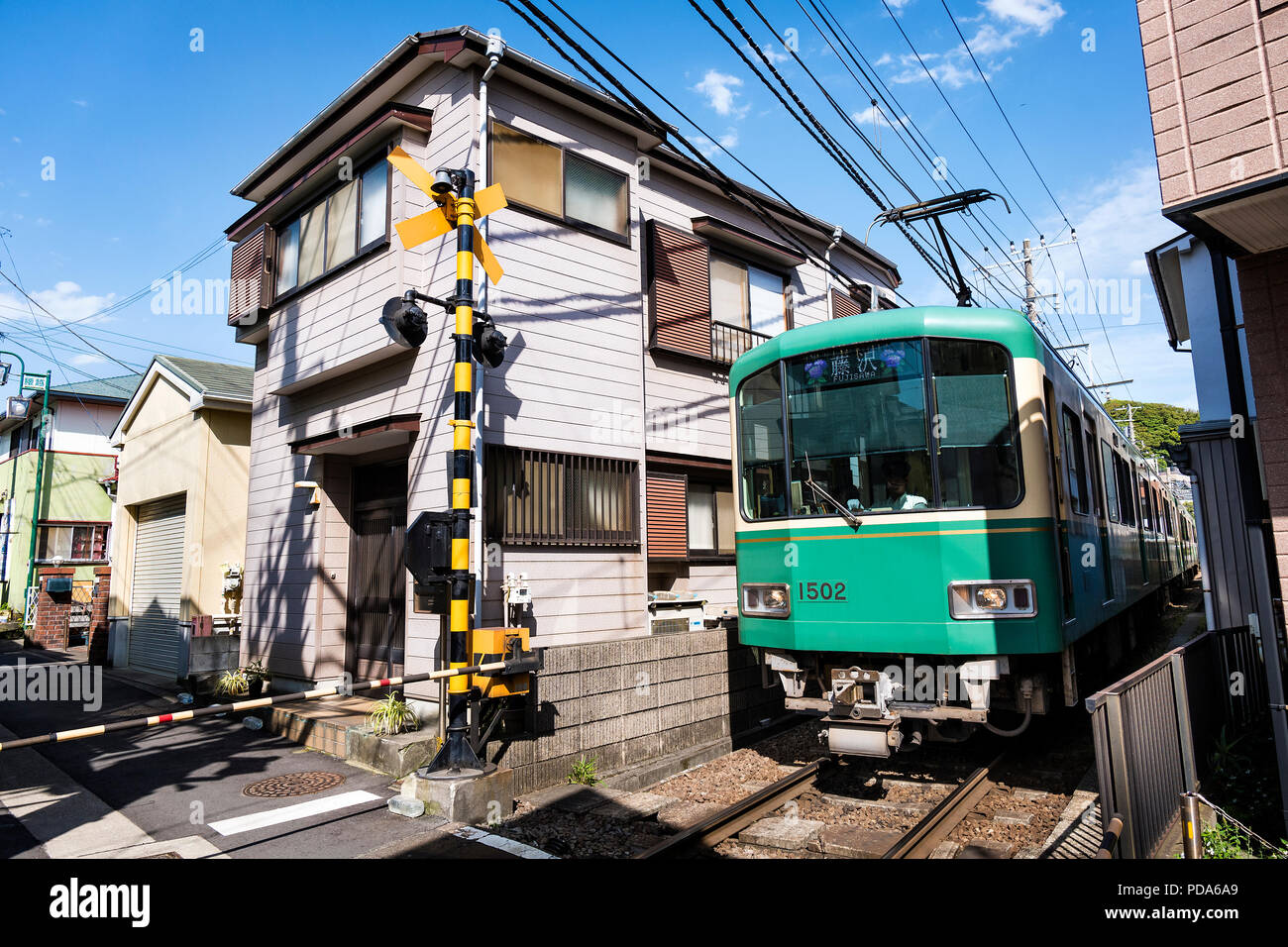 Japan, Honshu island, Kanto, Enoshima, inside the town, the train of ...