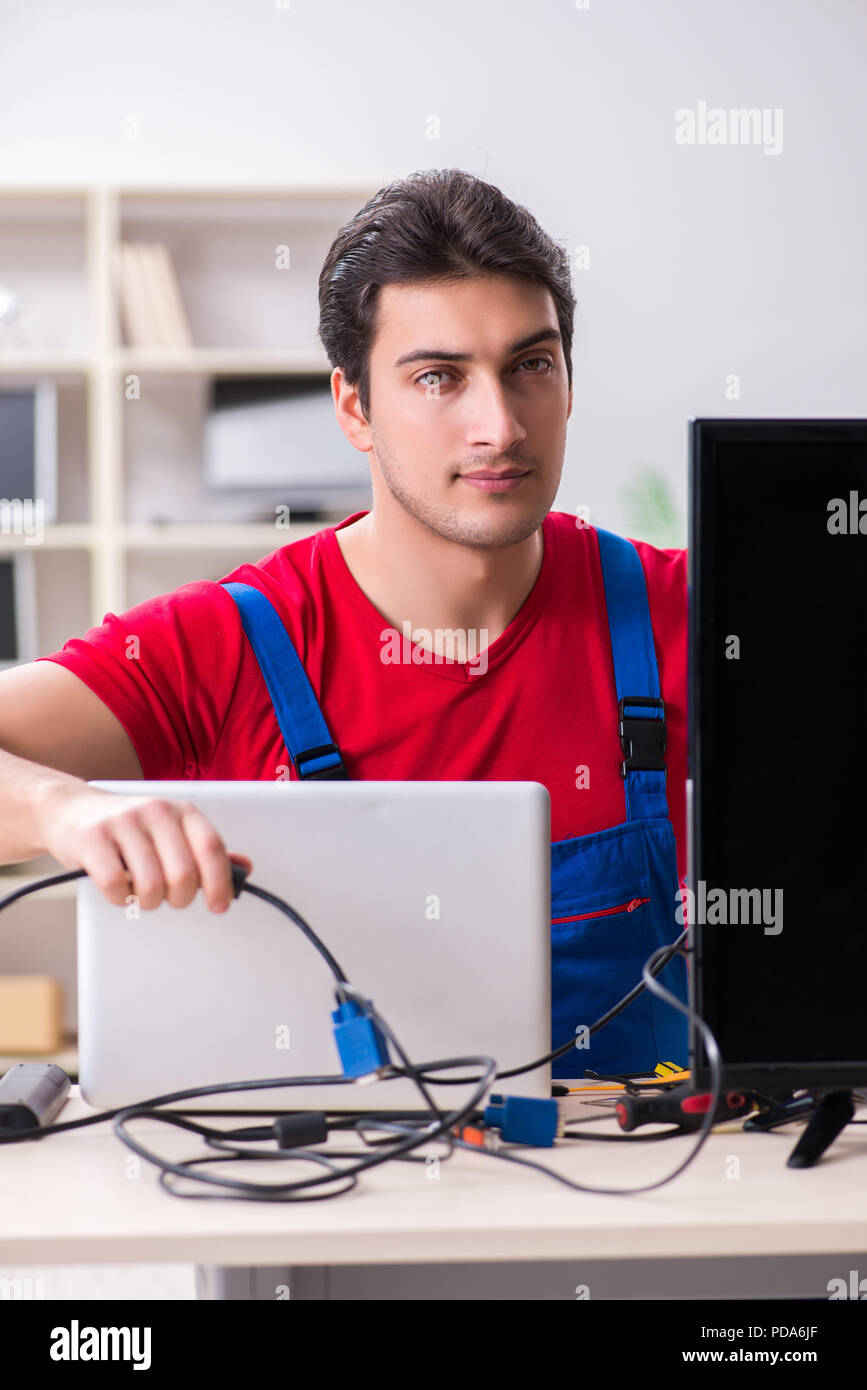 Professional repair engineer repairing broken tv Stock Photo - Alamy