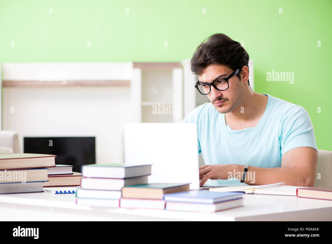 Student preparing for university exams at home Stock Photo - Alamy
