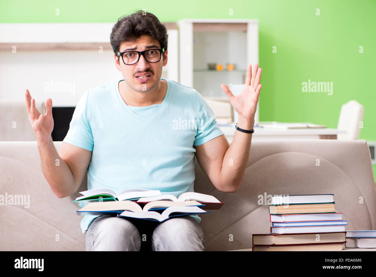 Student preparing for university exams at home Stock Photo - Alamy