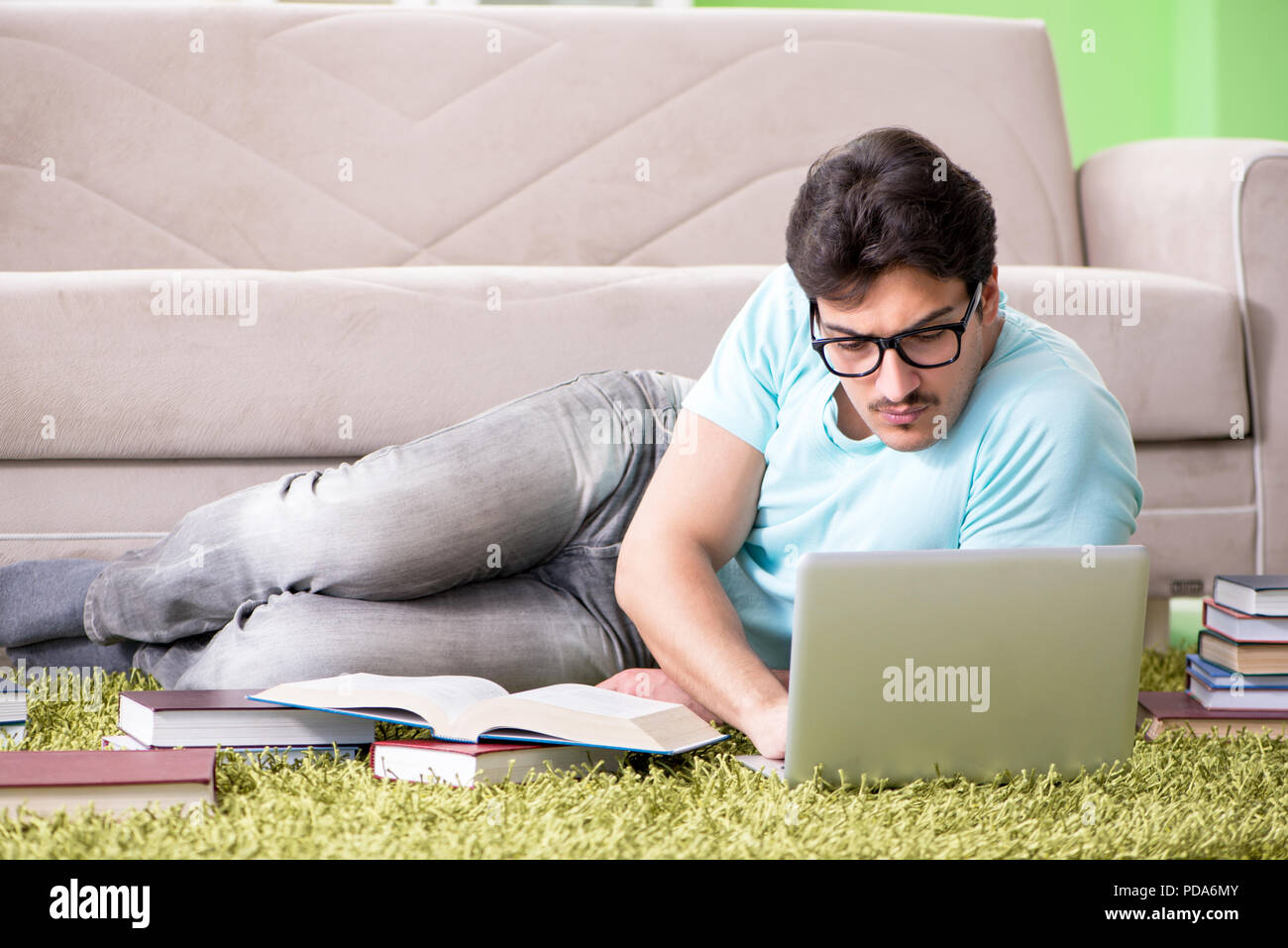 Student preparing for university exams at home Stock Photo - Alamy
