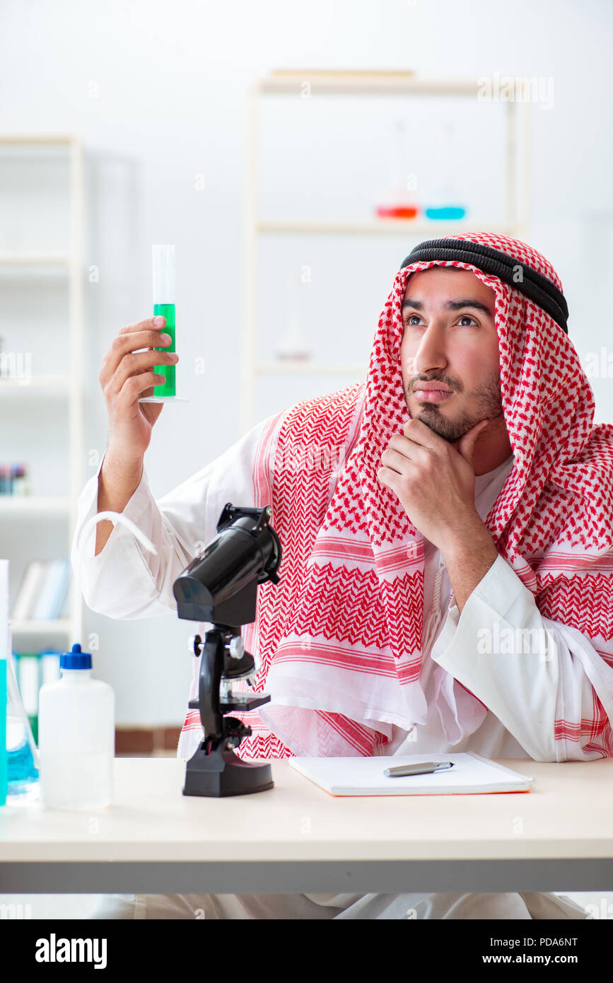 Arab chemist working in the lab office Stock Photo - Alamy