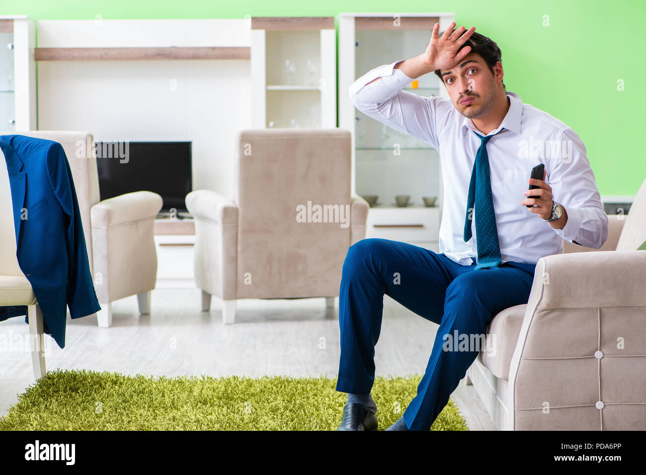 Man dressing up and late for work Stock Photo - Alamy