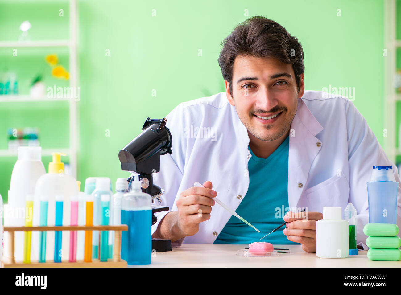 Chemist testing soap in the lab Stock Photo - Alamy