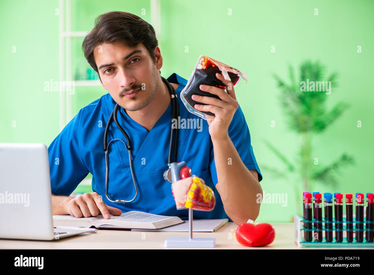 Doctor doing blood analysis in the lab Stock Photo - Alamy