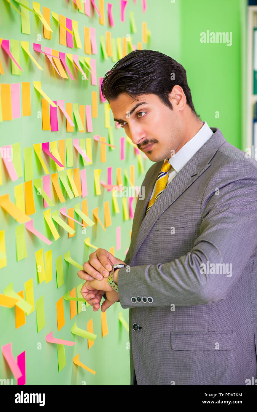 Businessman with many business priorities Stock Photo - Alamy
