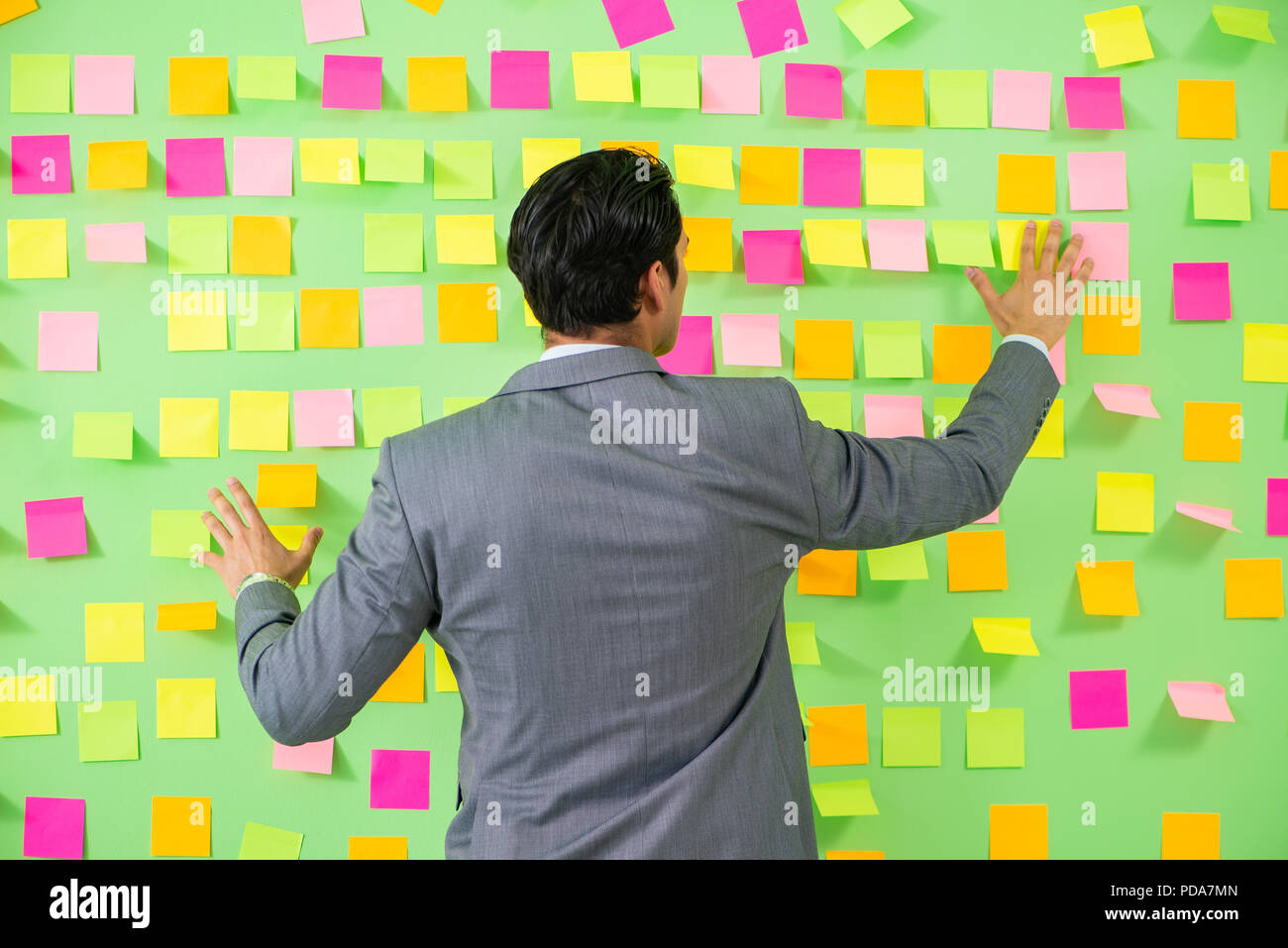 Businessman with many business priorities Stock Photo - Alamy