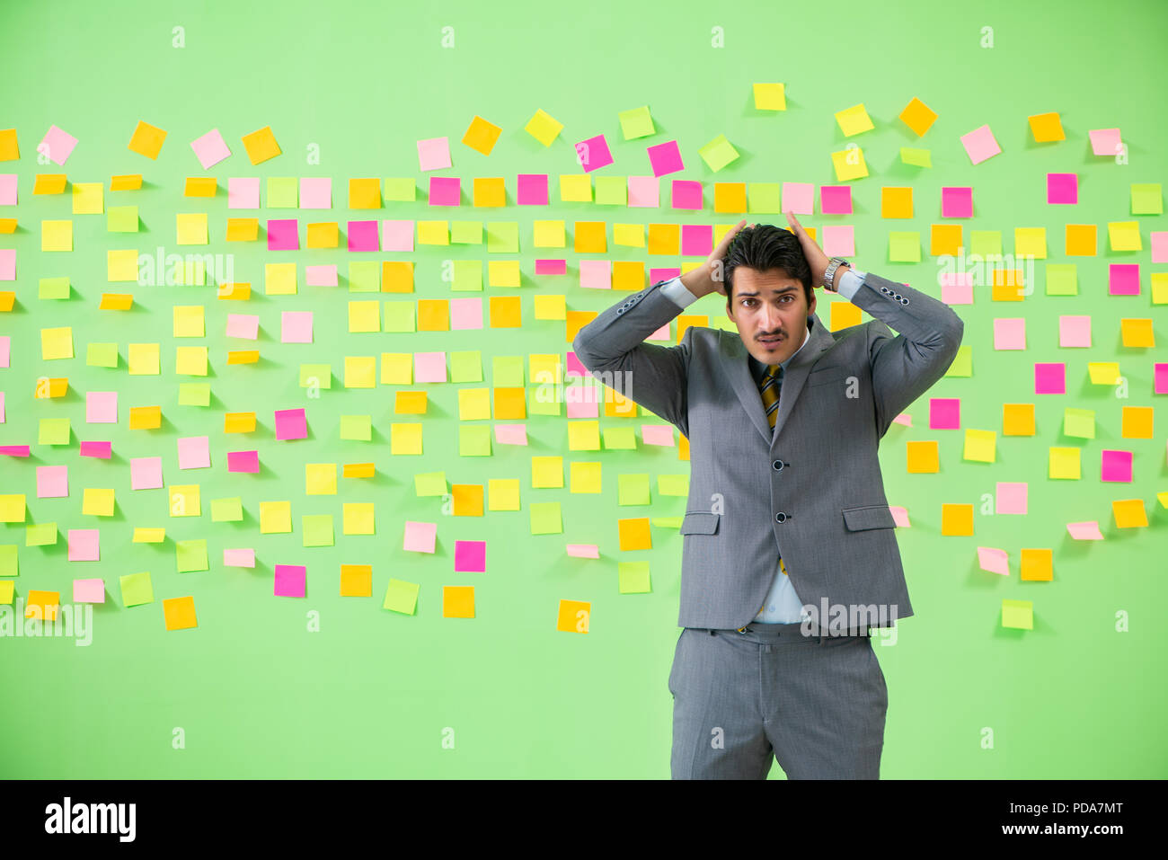 Businessman with many business priorities Stock Photo - Alamy