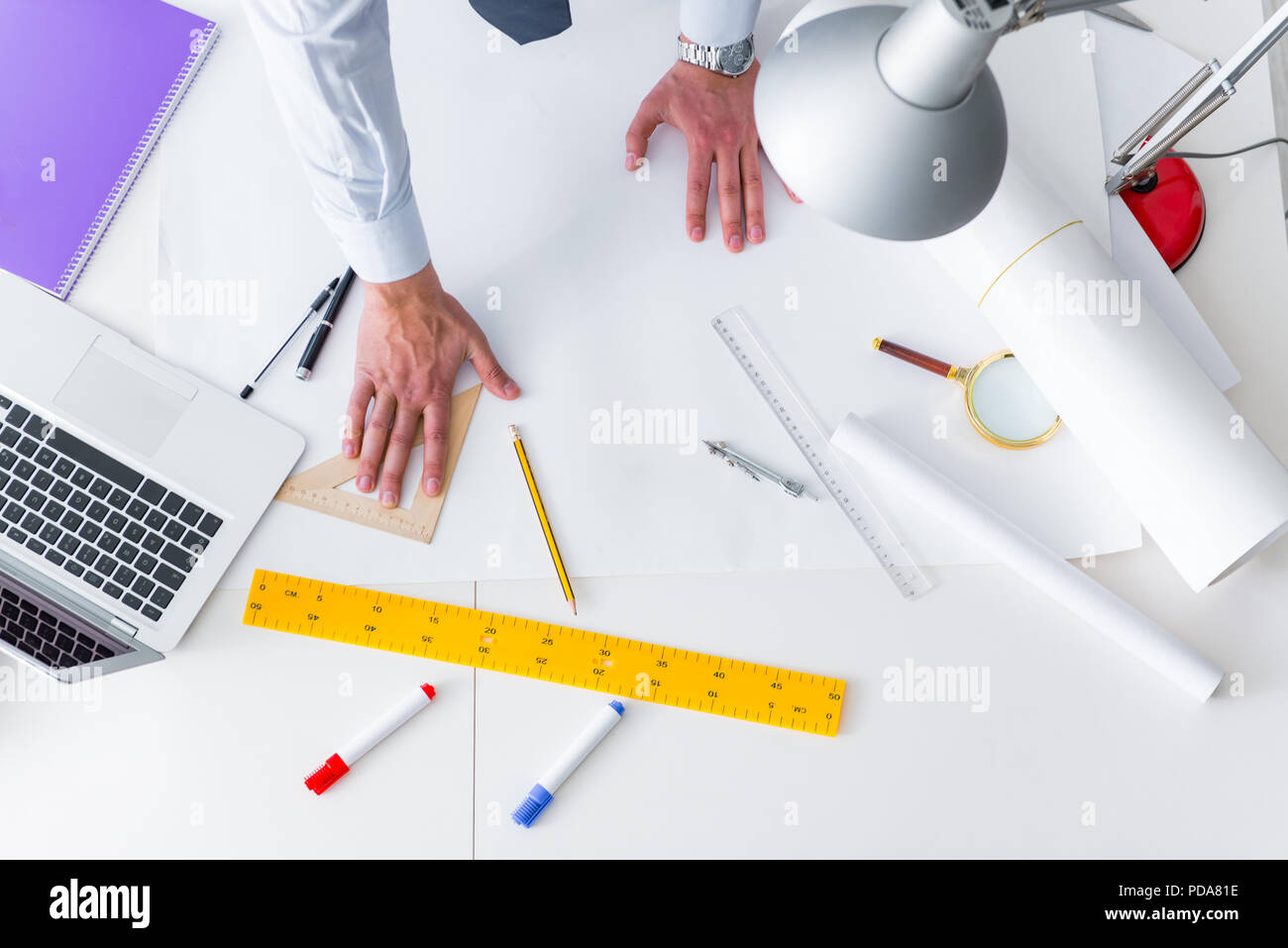 Engineer working on new project drawings Stock Photo - Alamy