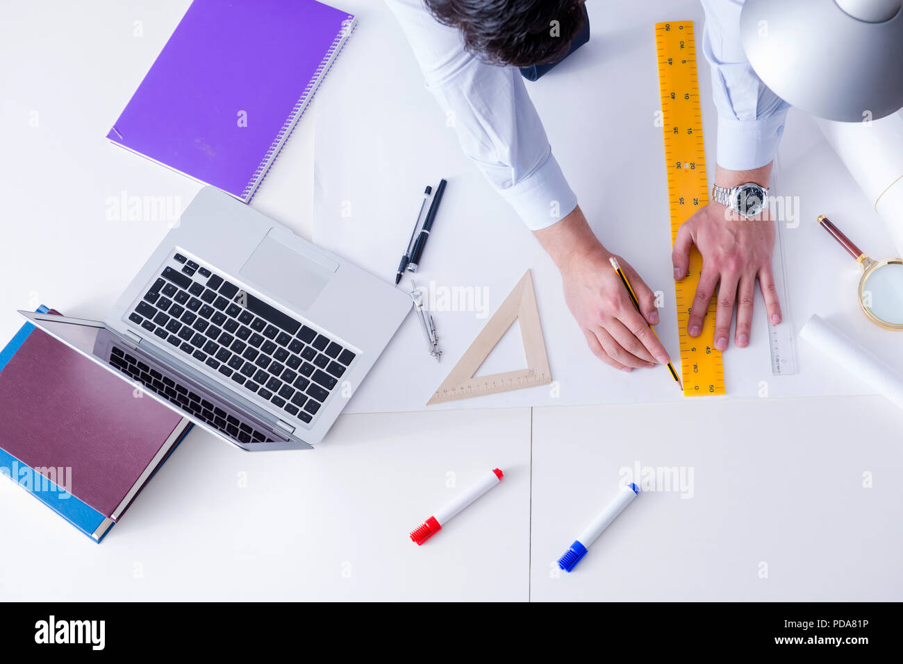Engineer working on new project drawings Stock Photo - Alamy