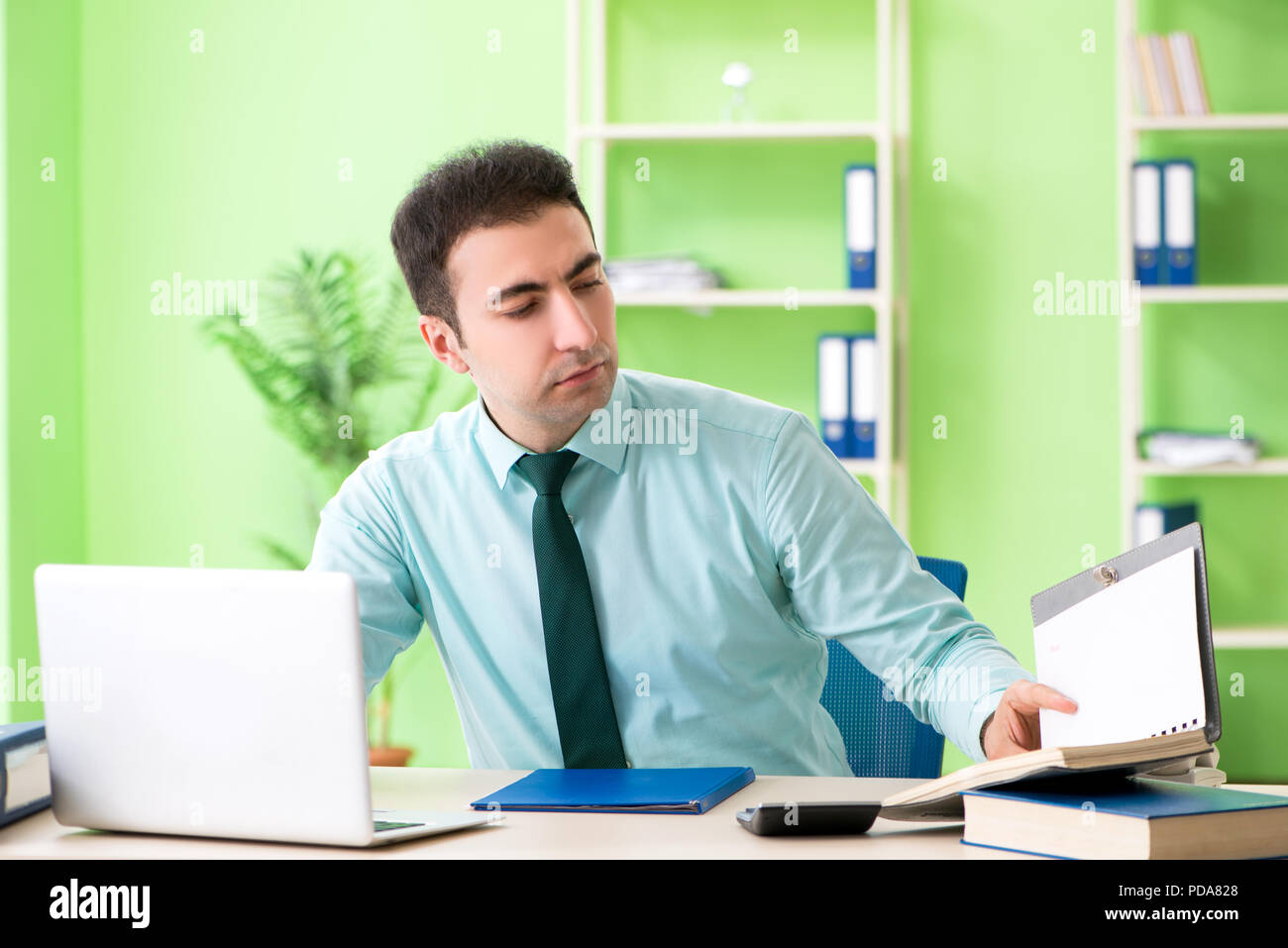 Male financial manager working in the office Stock Photo - Alamy