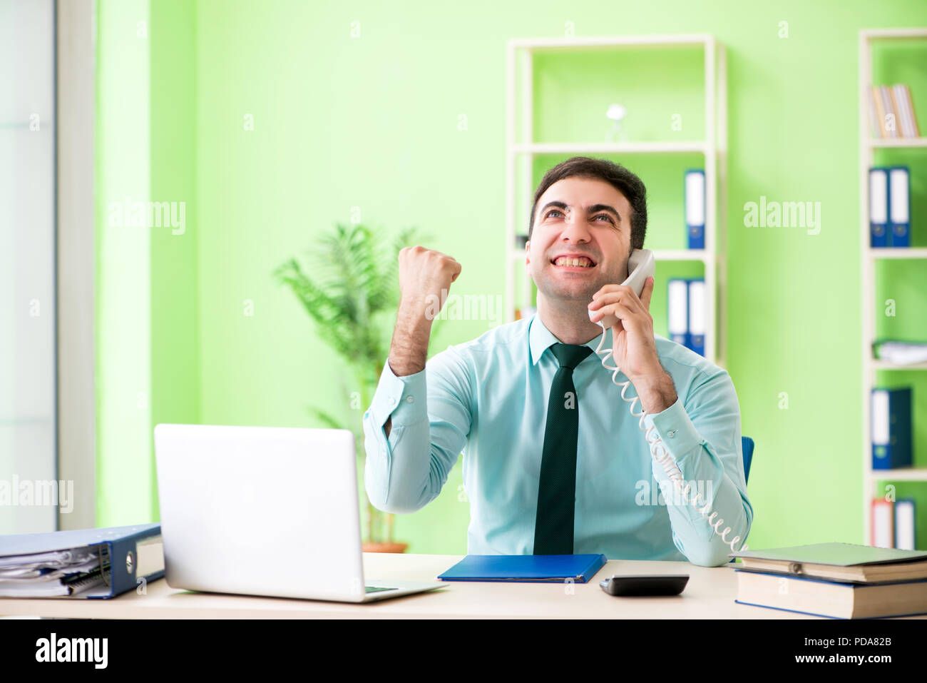 Male financial manager working in the office Stock Photo - Alamy