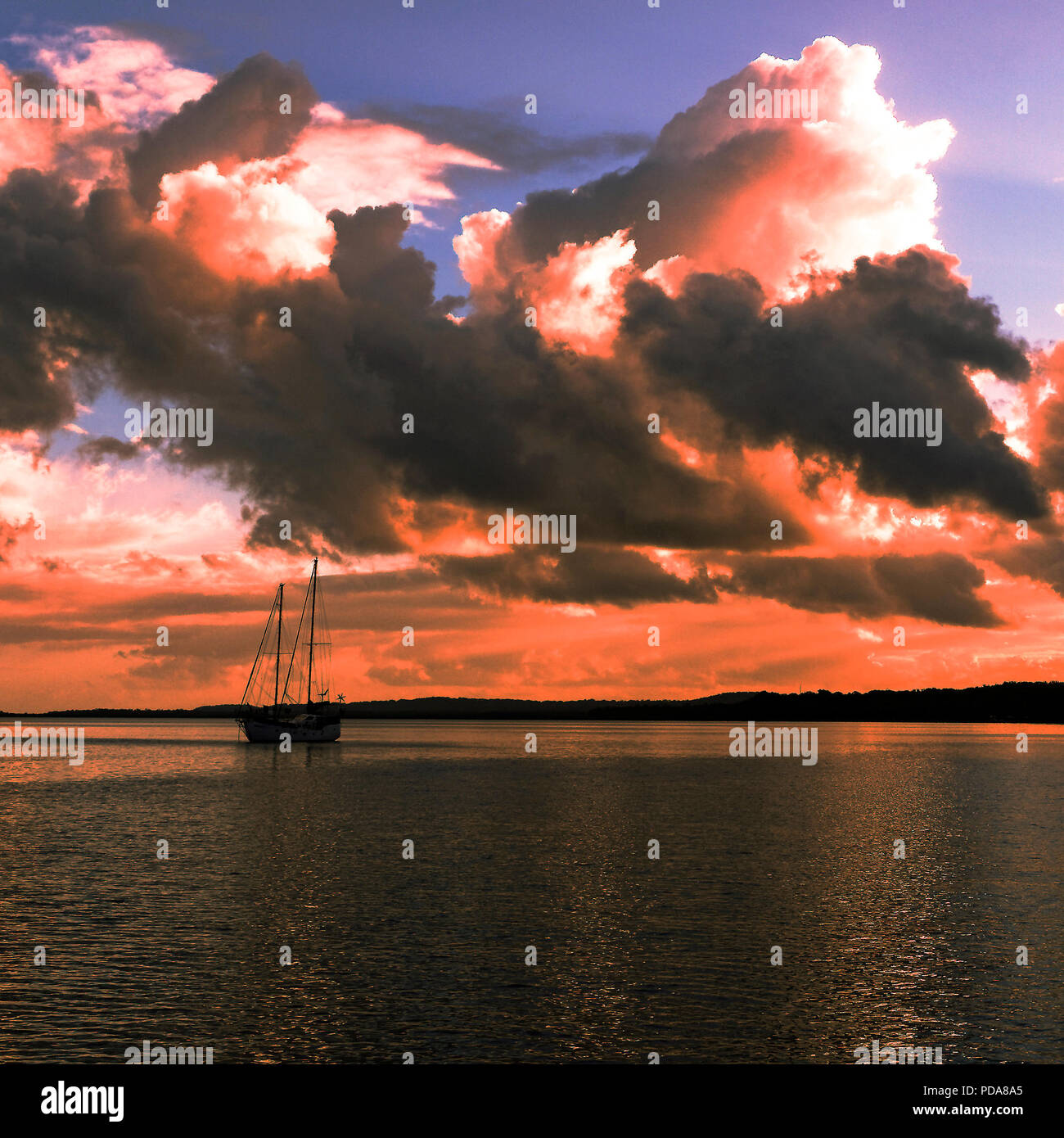 Summer sunset with predominately cumulonimbus clouds against a steel ...