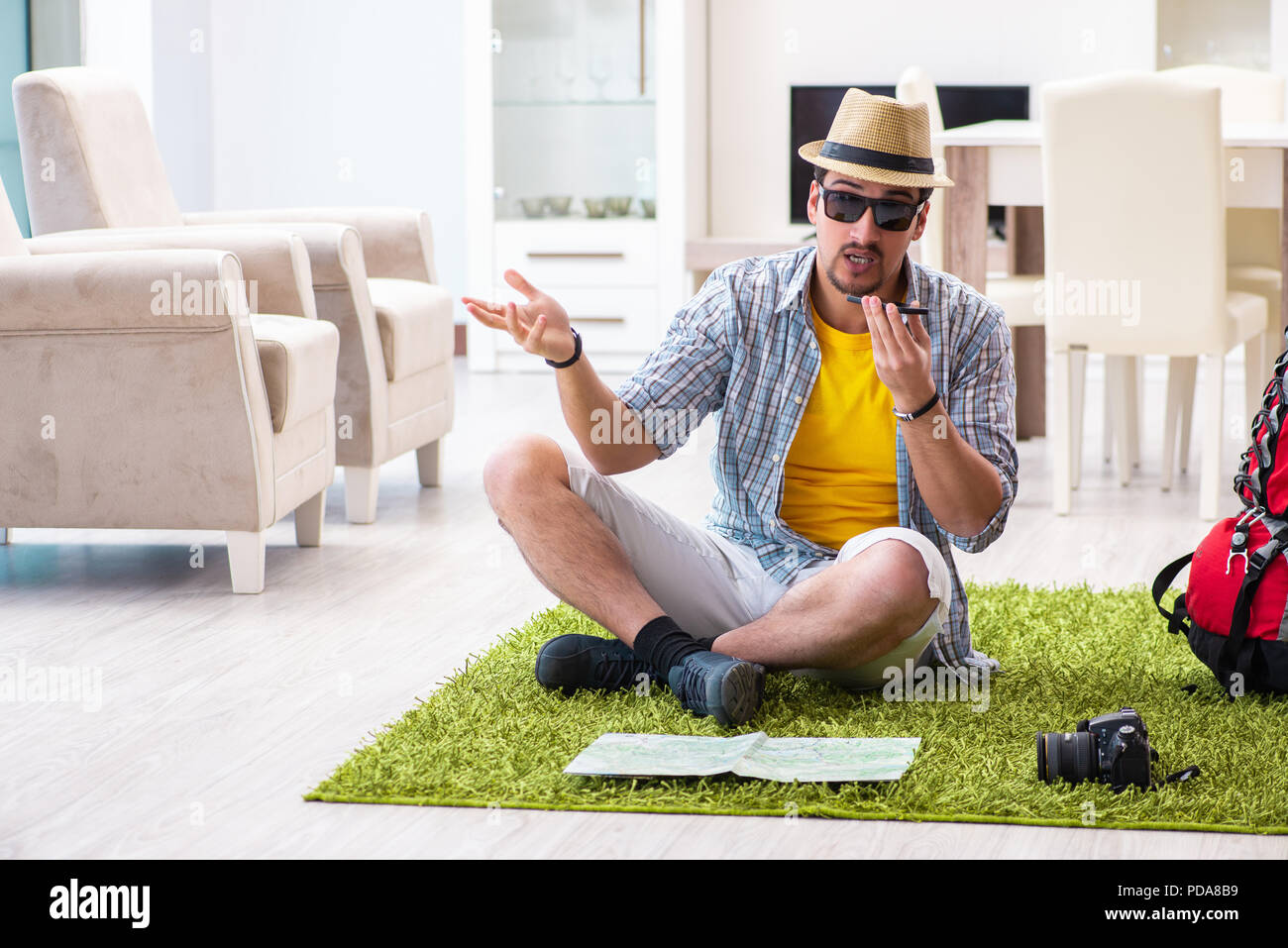 Man planning his travel with map Stock Photo - Alamy