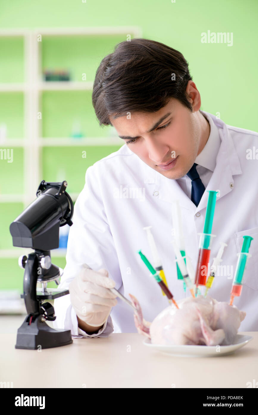 Lab assistant testing GMO chicken Stock Photo - Alamy
