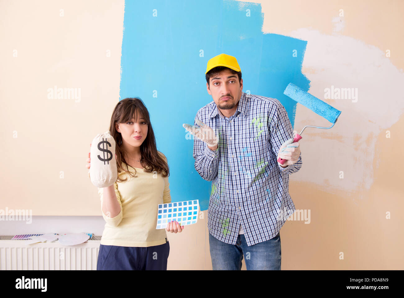 Husband and wife doing renovation at home Stock Photo - Alamy