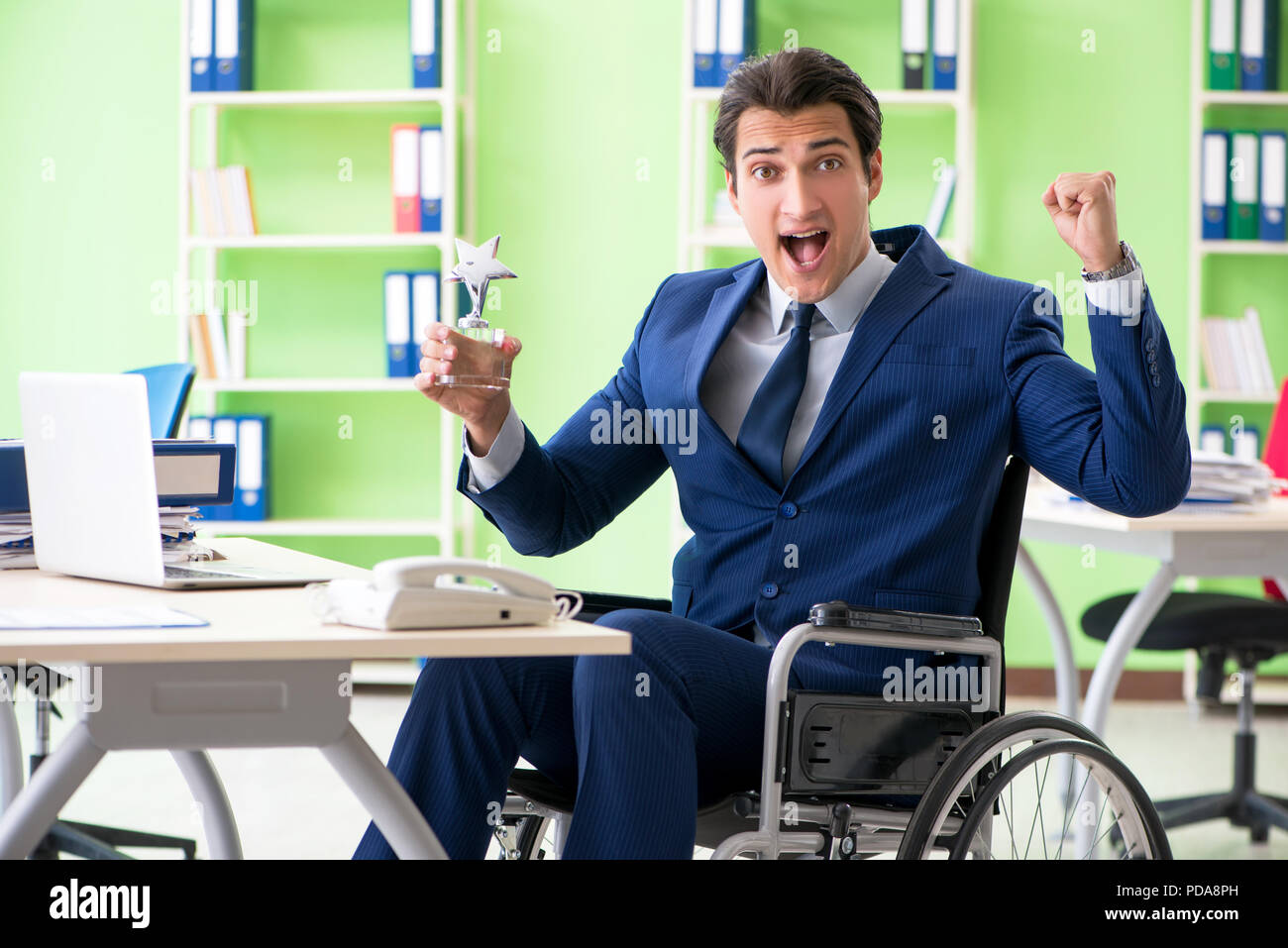 Disabled businessman working in the office Stock Photo - Alamy