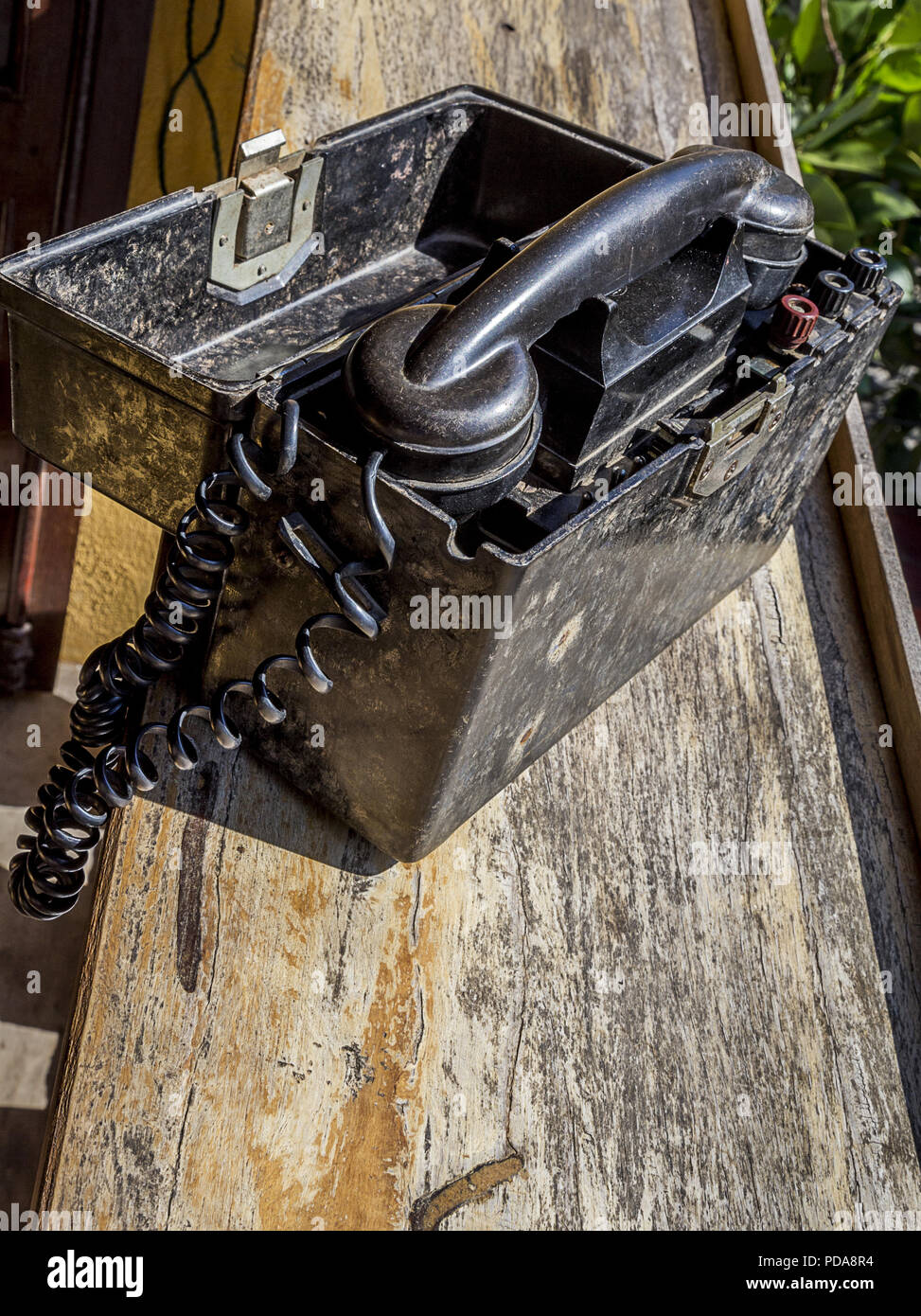 Aniique military phone sitting on an outdoor old piece of wood Stock ...