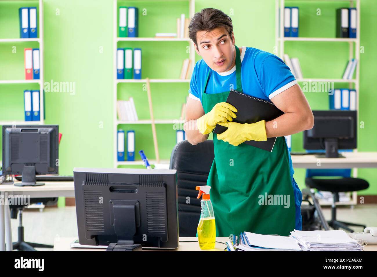 Male spy under cleaner cover stealing confidential documents Stock ...