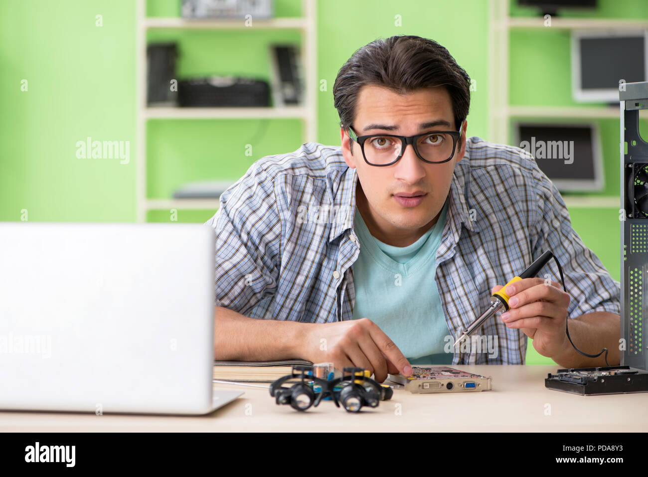 Computer engineer repairing broken desktop Stock Photo - Alamy