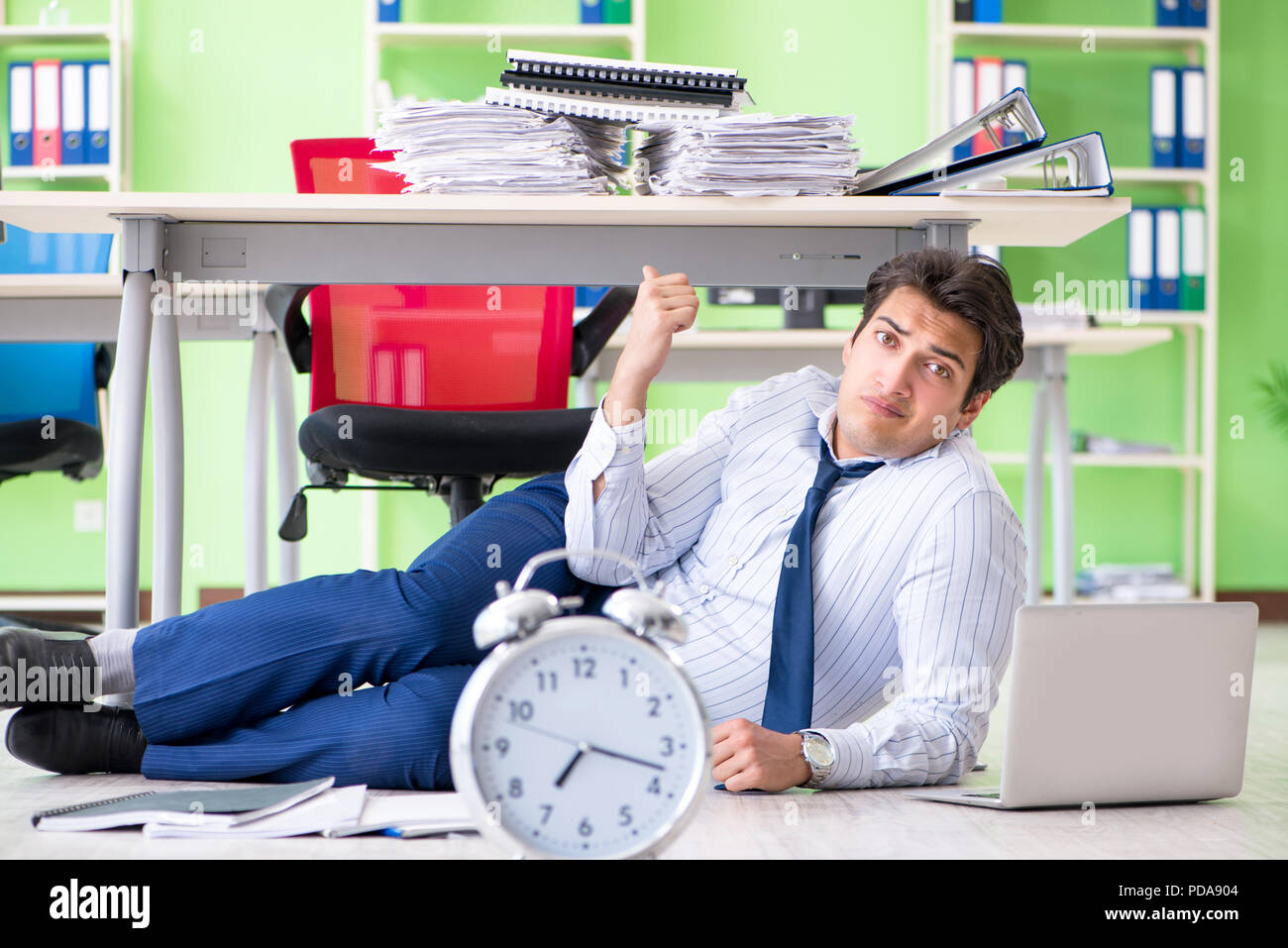Frustrated businessman stressed from excessive work Stock Photo - Alamy