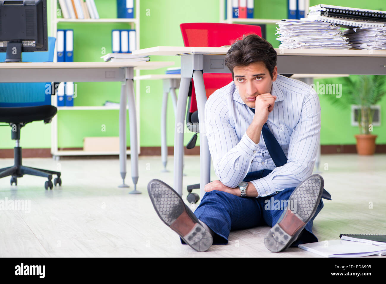 Frustrated businessman stressed from excessive work Stock Photo - Alamy