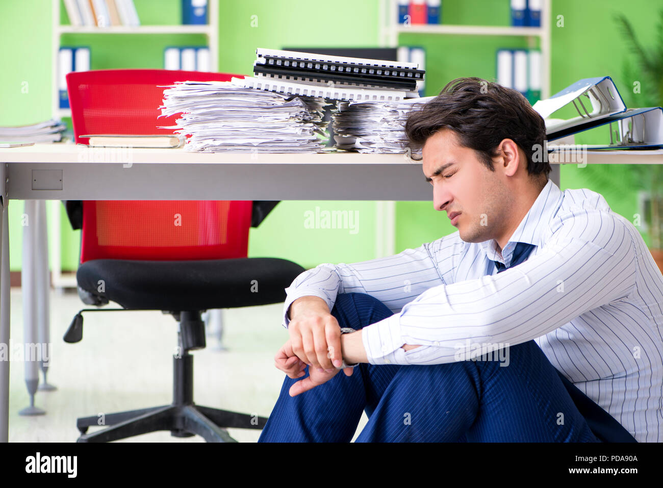 Frustrated businessman stressed from excessive work Stock Photo - Alamy