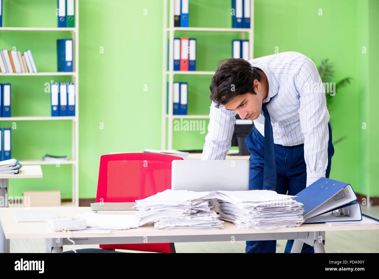 Frustrated businessman stressed from excessive work Stock Photo - Alamy