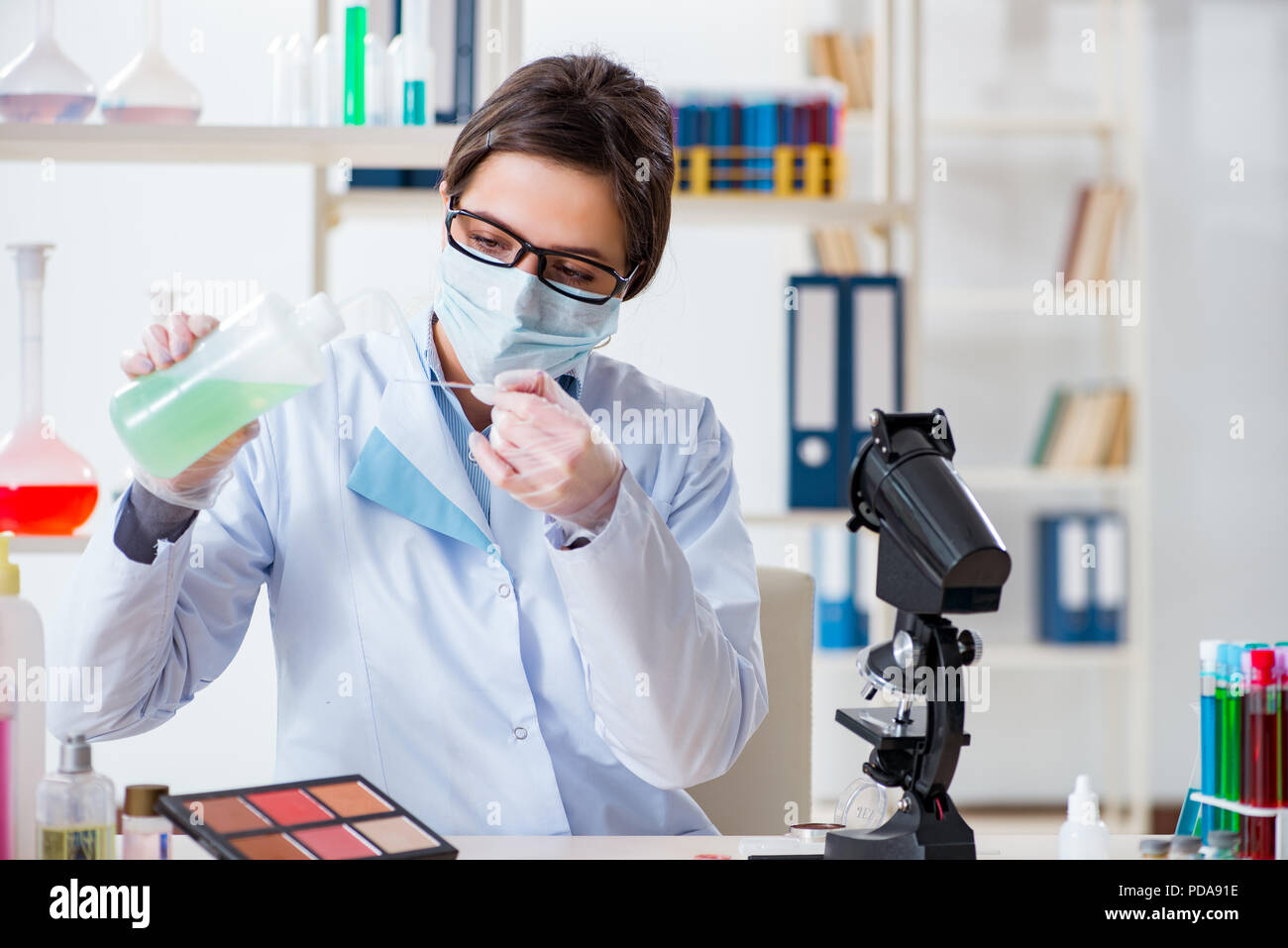 Lab chemist checking beauty and make-up products Stock Photo - Alamy