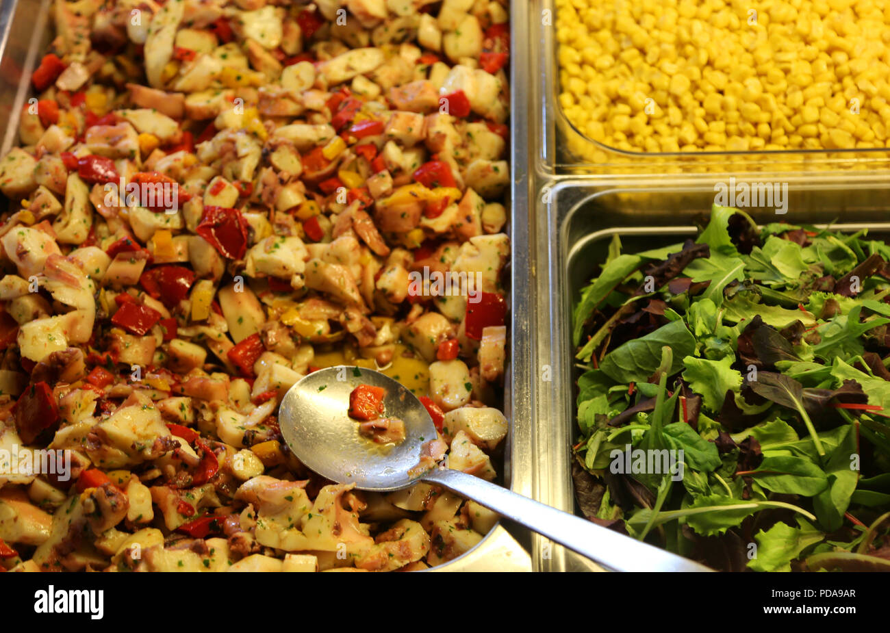 fish salad and trays with corn or lettuce for a light lunch break at ...