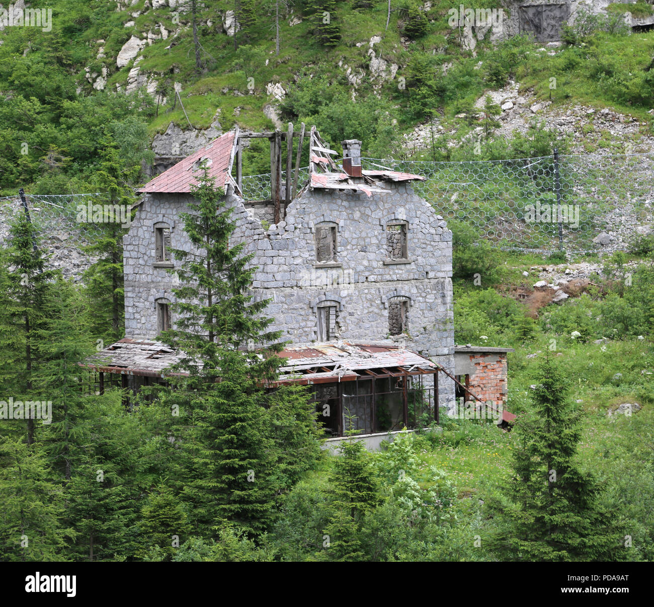ancient destroyed house of the last century abandoned in the middle of ...