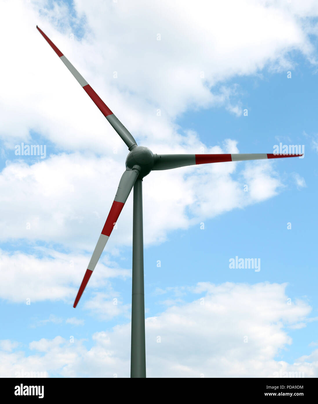 white and red wind turbine used to produce clean energy with the wind ...