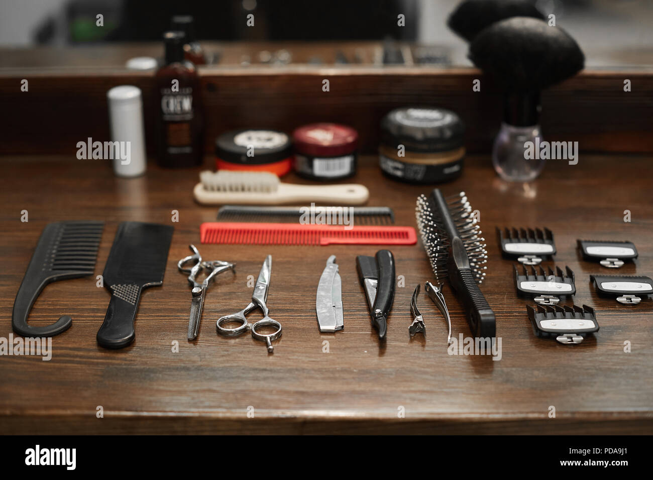 Tools for a hairdresser on a dark wooden table at a barber shop ...
