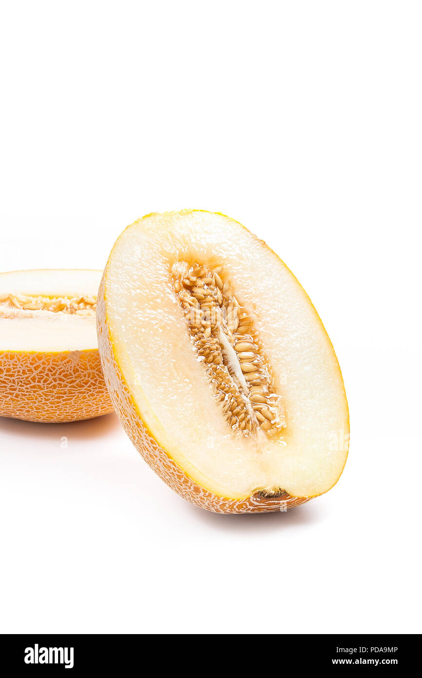 Half ripe juicy melon tropical fruit at summer time isolated on a white ...