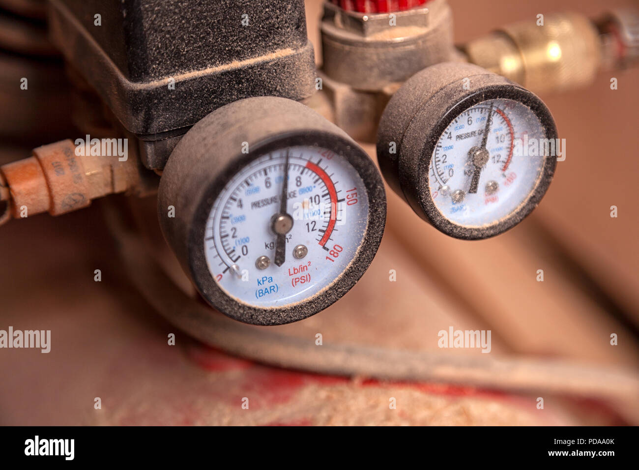 Close-up of a reducer and a pressure sensor on modern equipment in the ...