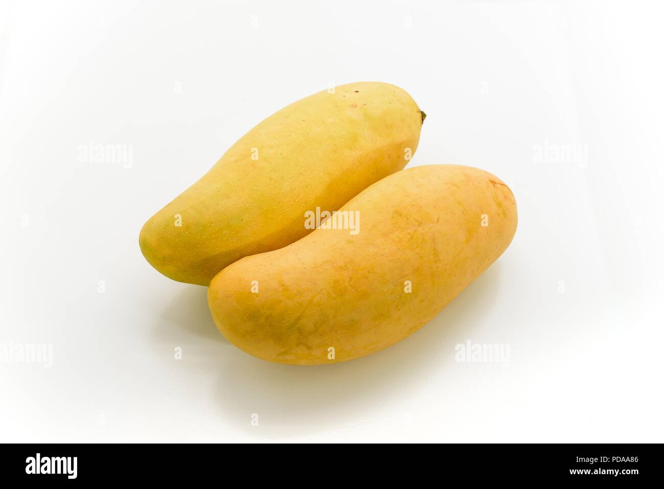 Two mangoes isolated on white background Stock Photo - Alamy