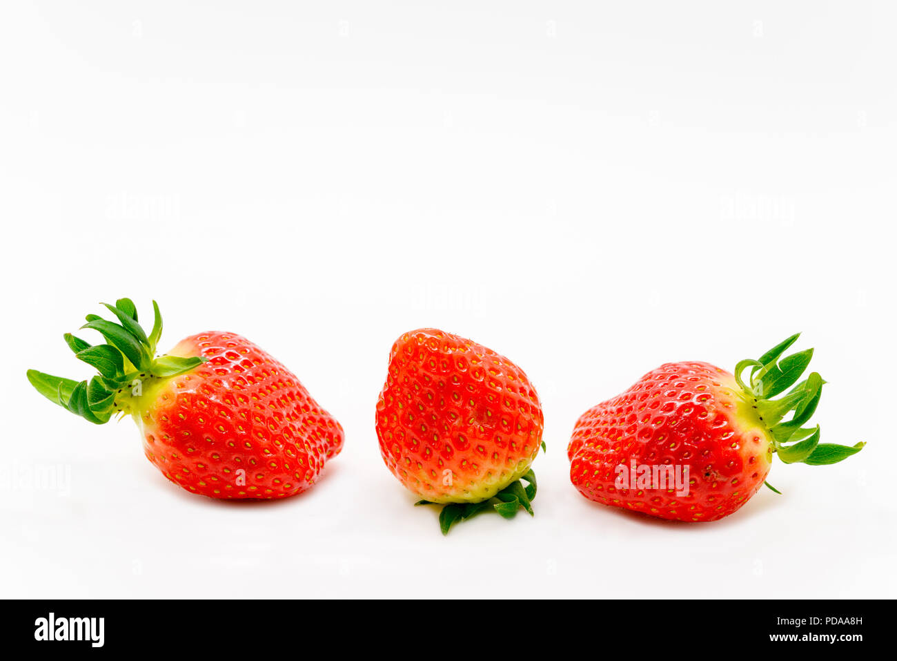 Fresh strawberries isolated on white background Stock Photo - Alamy
