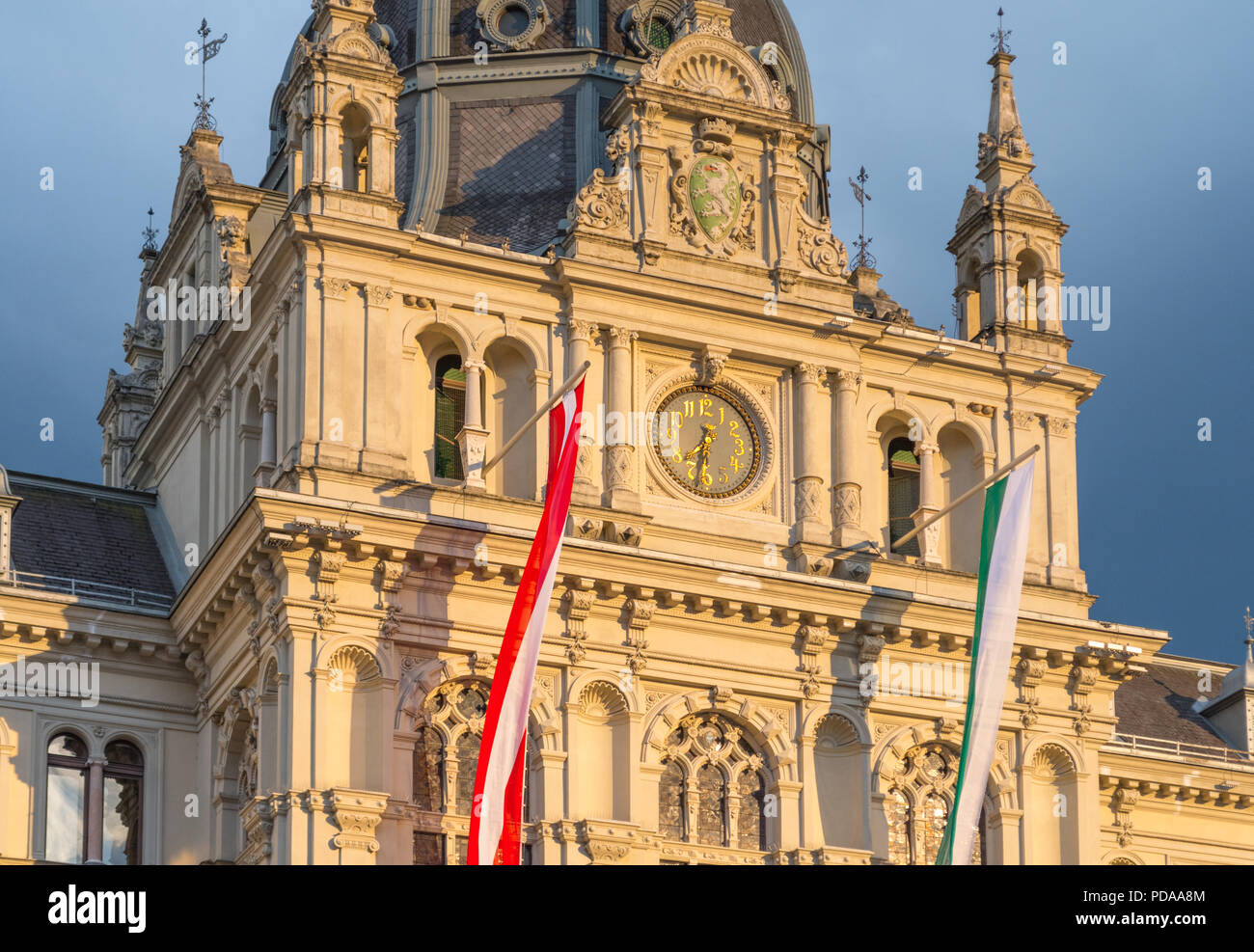 Facade of the Town Hall of Graz with a clock, the Austrian and Styrian ...