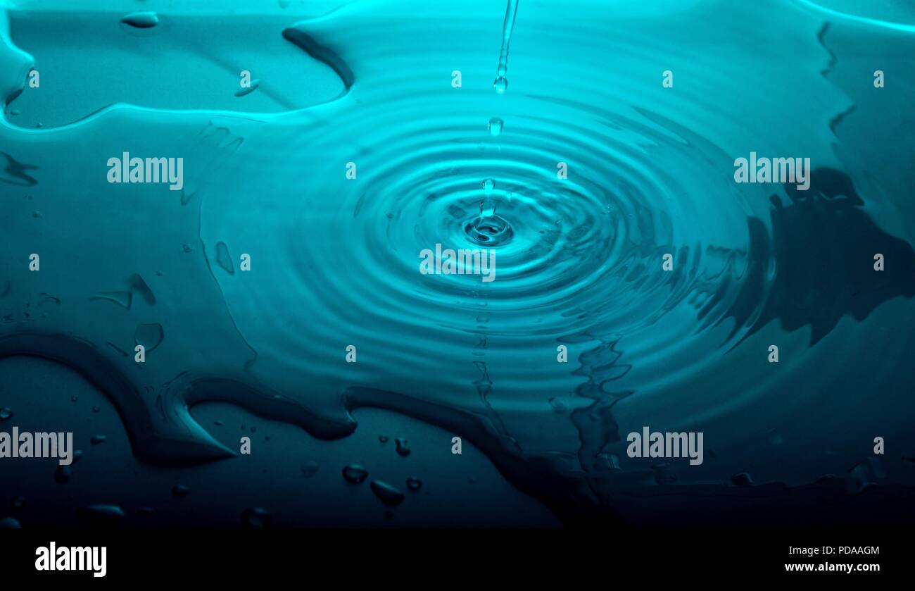 Water splash effect in blue with drops Stock Photo - Alamy