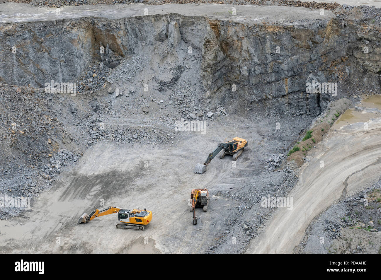 Mining in the granite quarry. Working mining machine - digger. Mining ...