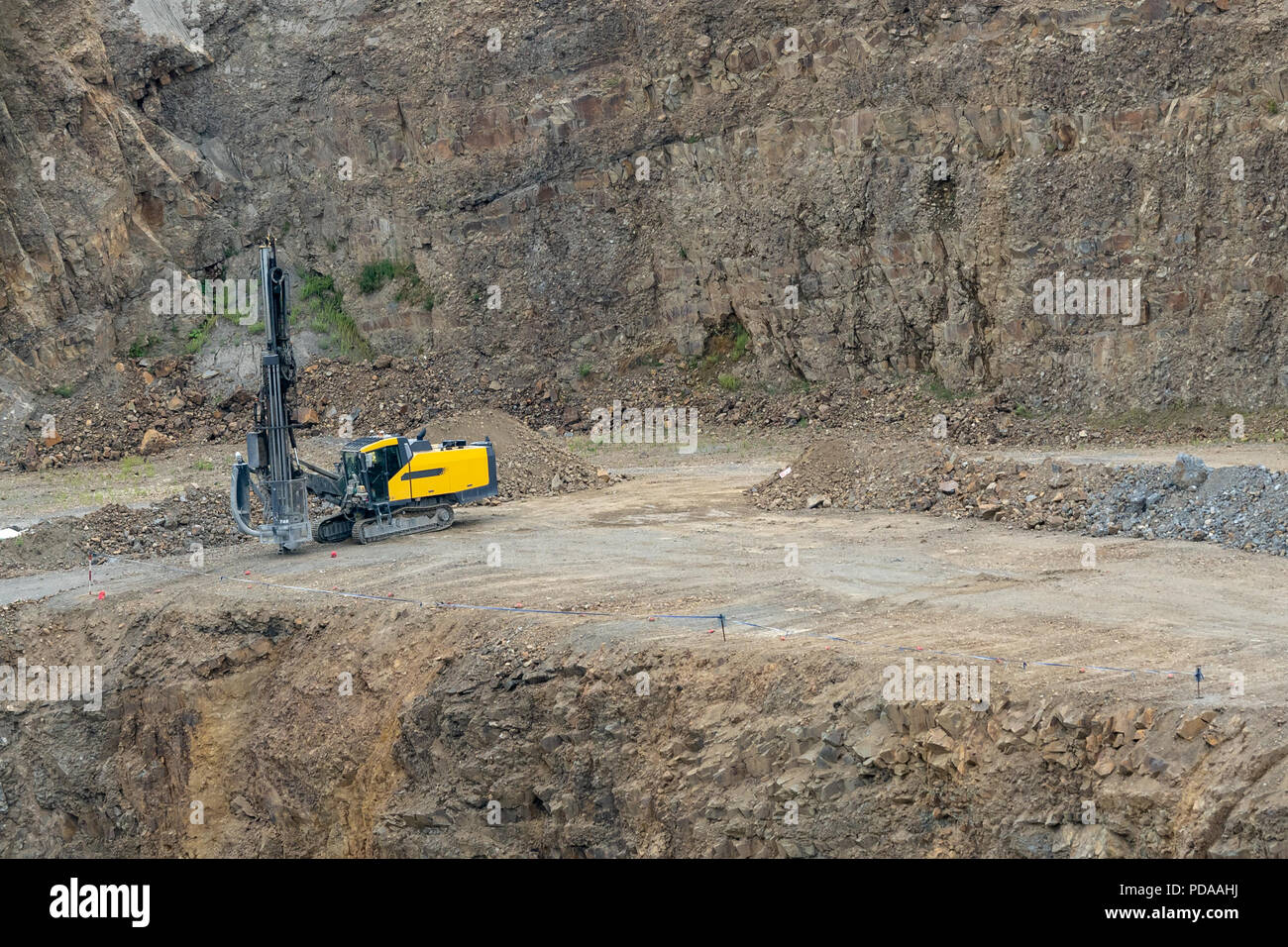 Opencast mining quarry with mining drilling machine. Mining in the ...