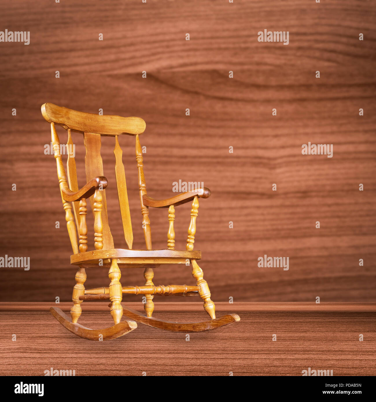 wood rocking chair with wood background Stock Photo - Alamy